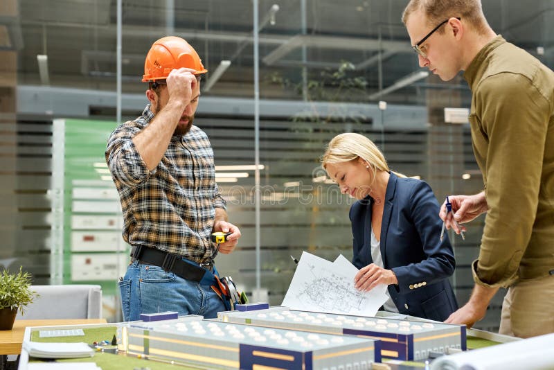 Female Director Supervising the Process of Work by Architect Stock ...