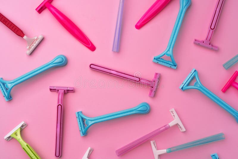 Female Disposable Razors on Pink Background Top View Stock Photo ...