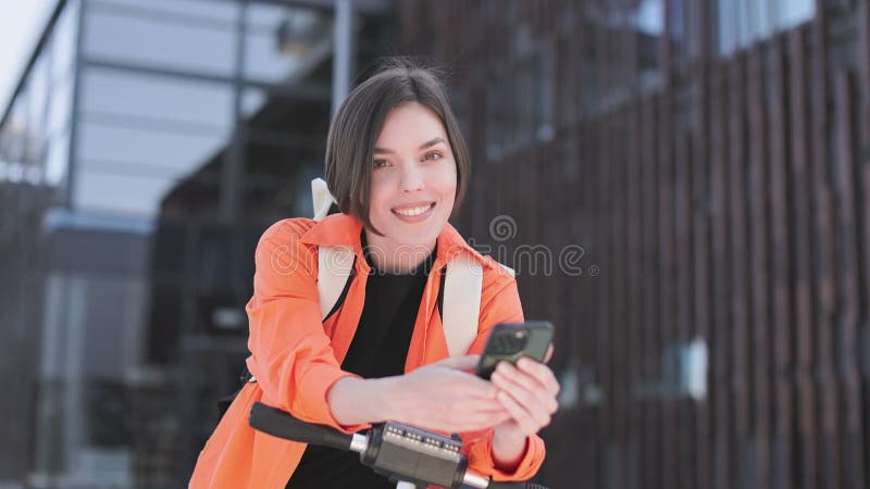 Female Distracting from Using Gadget and Looking at Camera Stock ...