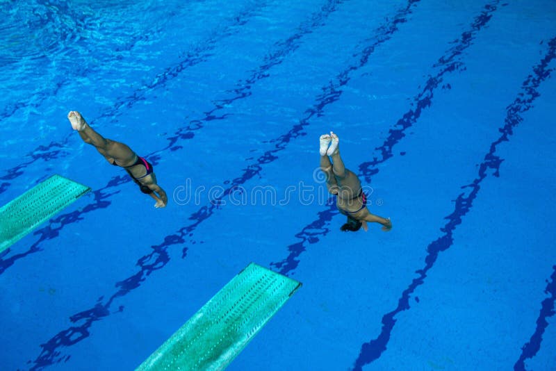 Female Diver Jumping from Board, Demonstrating Grace and Precision in ...