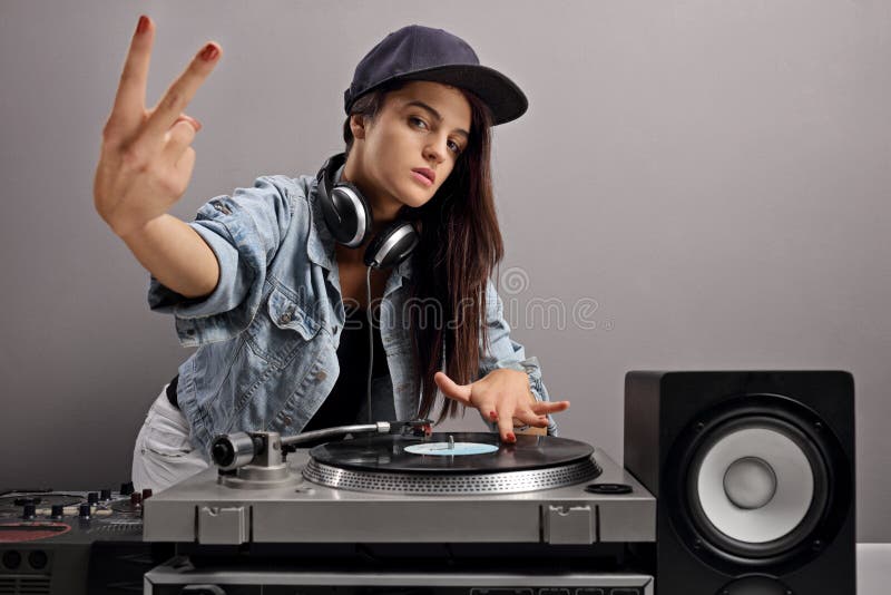 Female DJ Making a Peace Sign Stock Photo - Image of female, equipment ...