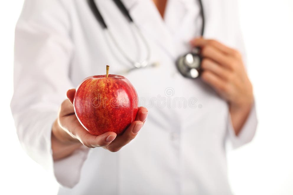 Female doctor with apple stock image. Image of standing - 29552427