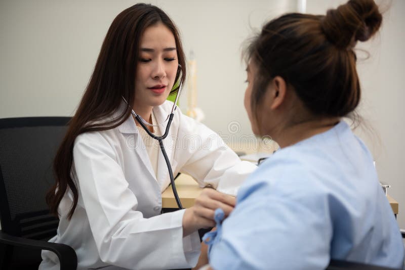 Female Doctor Cardiologist Examining Fat Woman Cardiac Patient