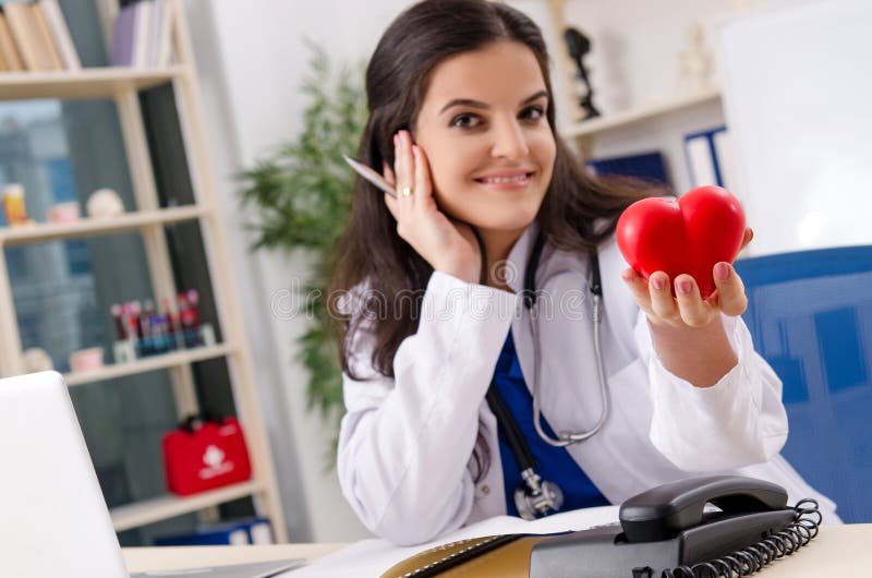 The Female Doctor Cardiologist Working in the Clinic Stock Image ...