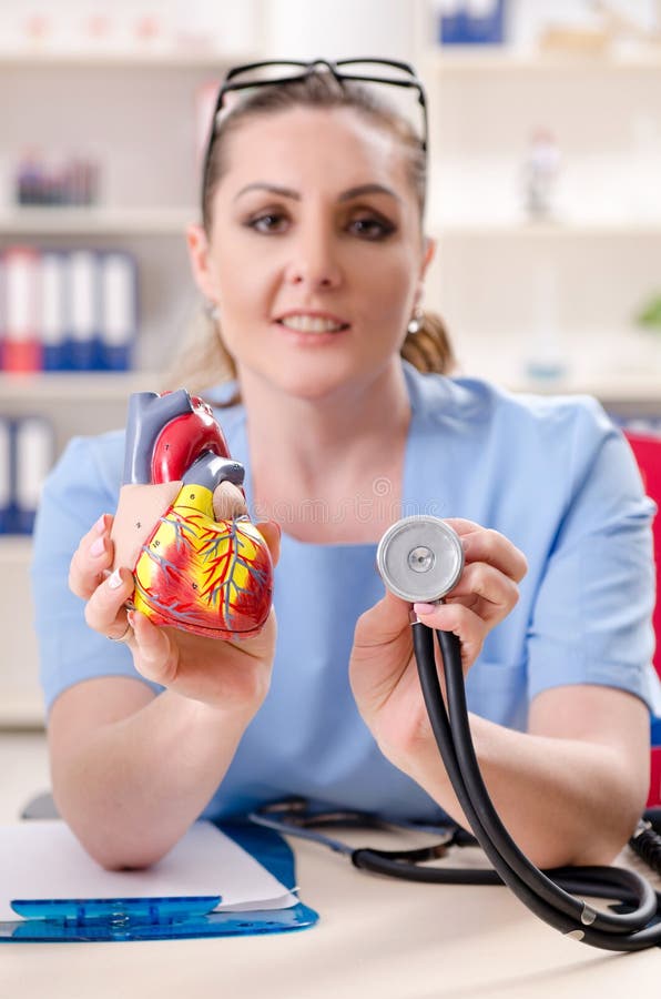The Female Doctor Cardiologist Working in the Clinic Stock Photo ...