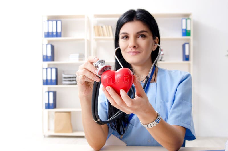 The Female Doctor Cardiologist Working in the Clinic Stock Photo ...