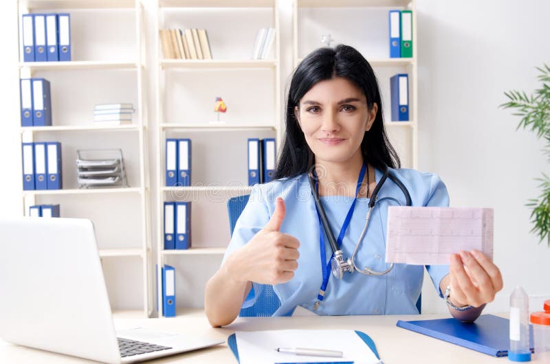 The Female Doctor Cardiologist Working in the Clinic Stock Image ...