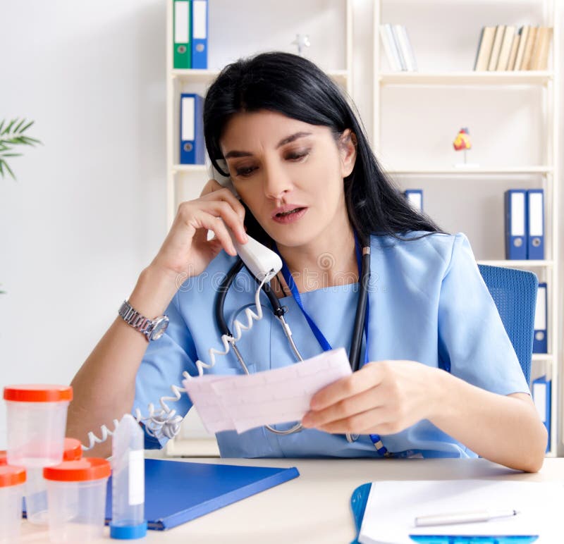 The Female Doctor Cardiologist Working in the Clinic Stock Photo ...