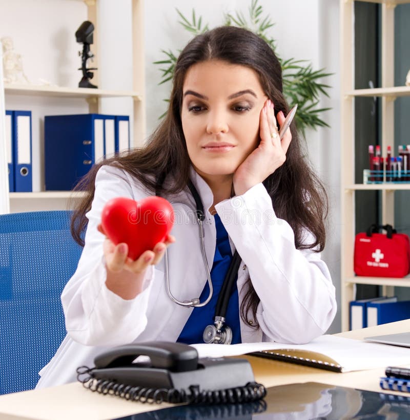 The Female Doctor Cardiologist Working in the Clinic Stock Photo ...