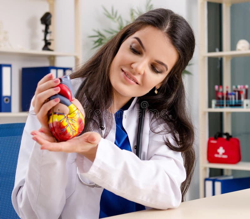 The Female Doctor Cardiologist Working in the Clinic Stock Image ...