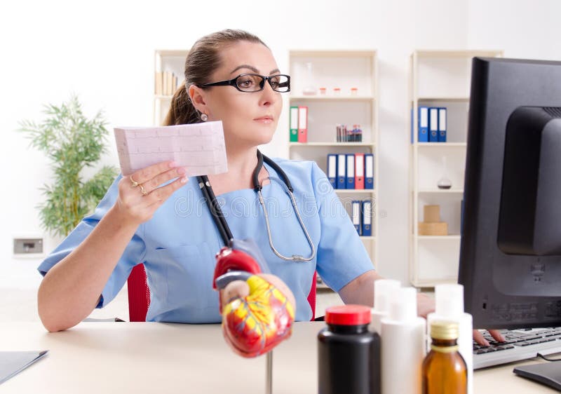 Female Doctor Cardiologist Working in the Clinic Stock Photo - Image of ...