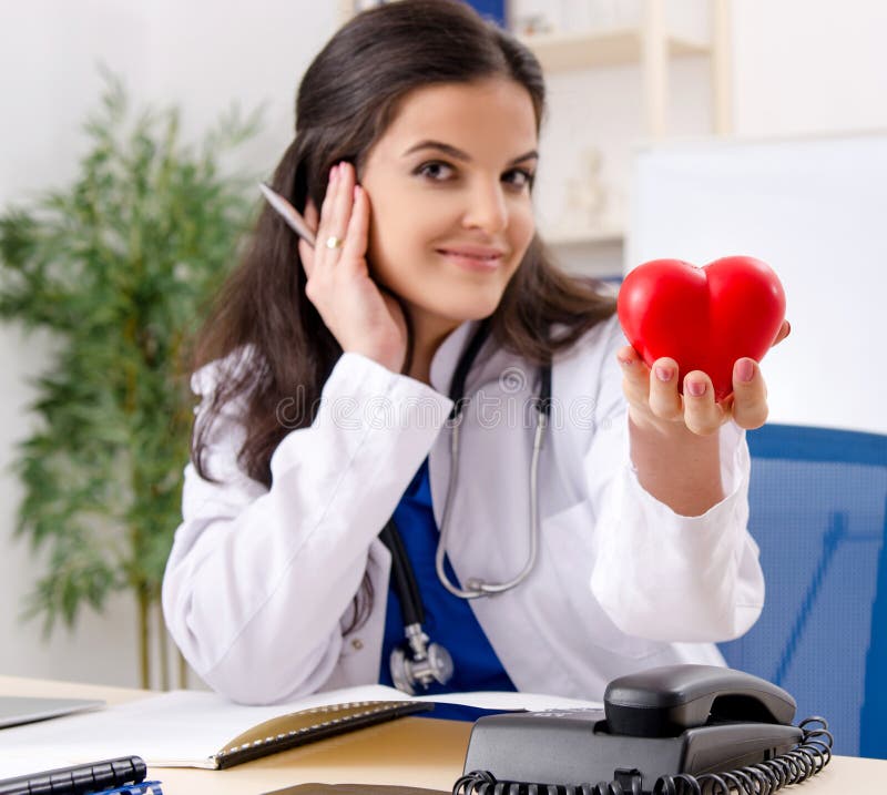 Doctor Cardiologist Holds Red Heart in Air Stock Image - Image of ...