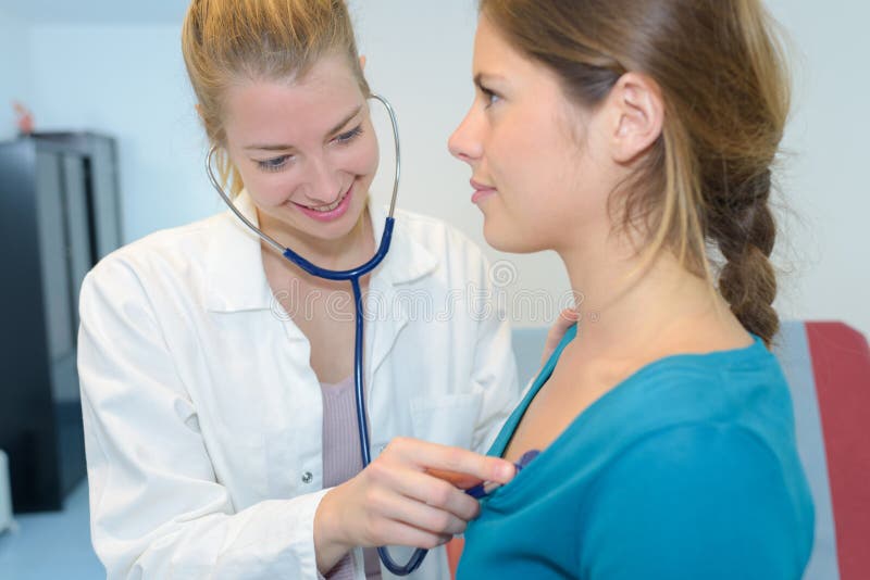 Female Doctor Checking On Female Patient Heart Rate Stock Image Image