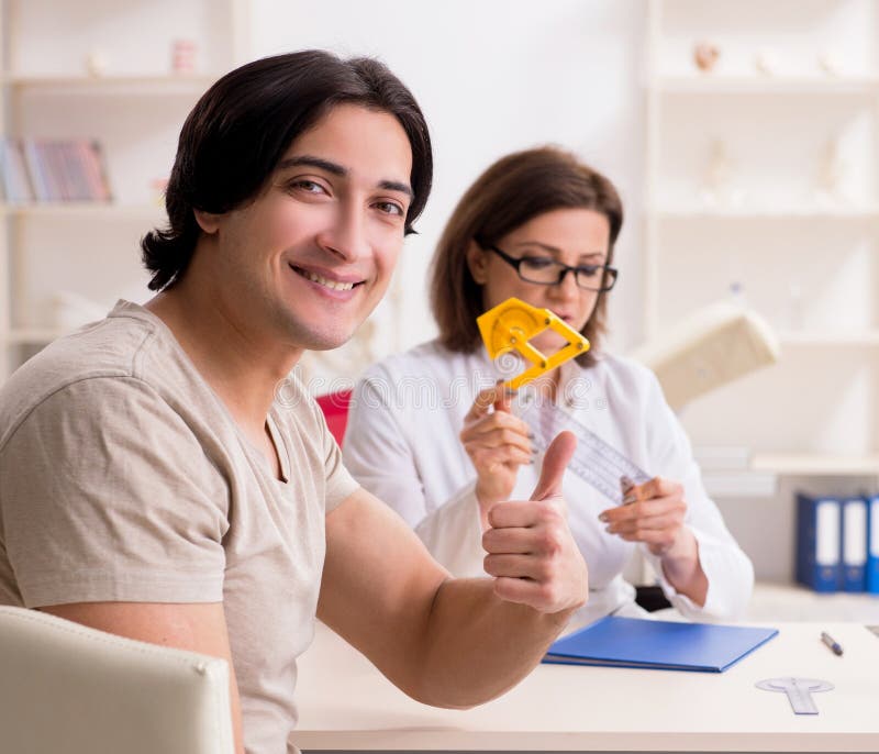 Female Doctor Checking Patient S Joint Flexibility with Goniomet Stock ...