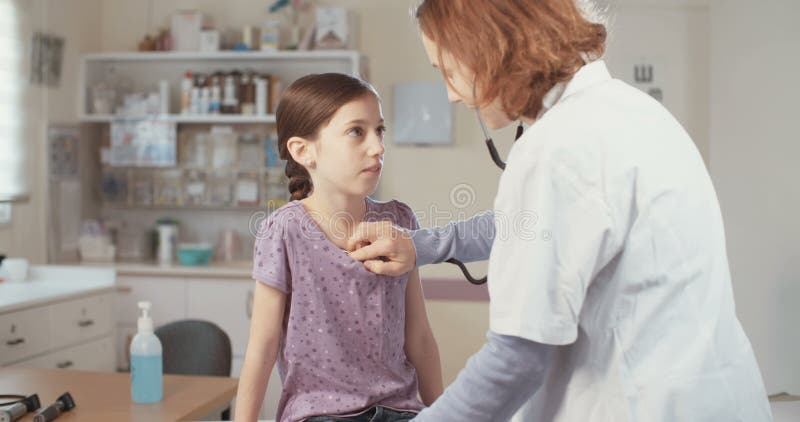 Female Doctor Checking a Young Girl Stock Video - Video of cute ...