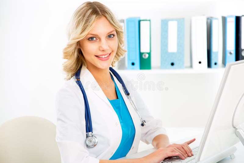 Female doctor at computer stock image. Image of desk - 89816825