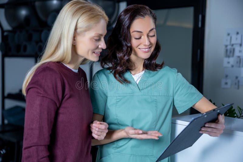 Female Doctor Explaining To the Patient Diagnostics Results Stock Photo ...