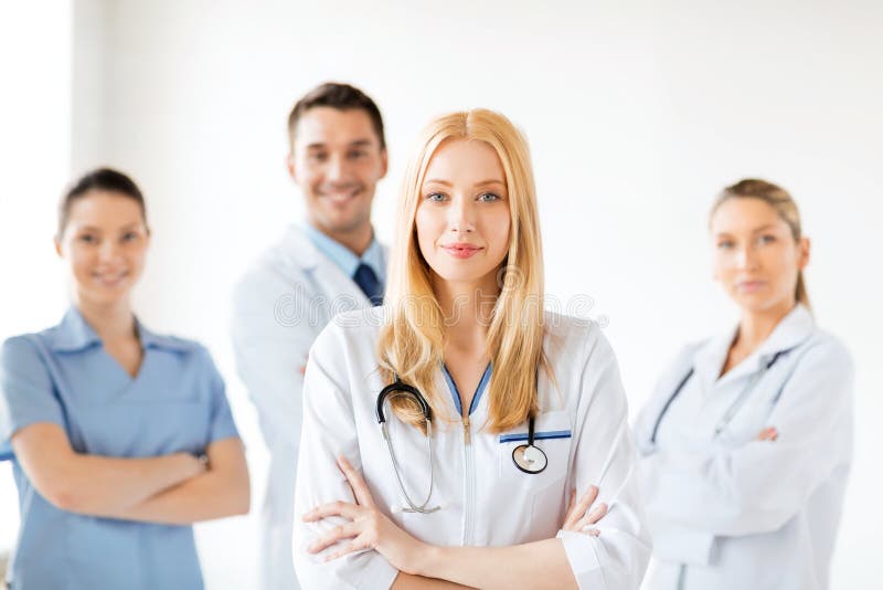 Female Doctor in Front of Medical Group Stock Photo - Image of people ...