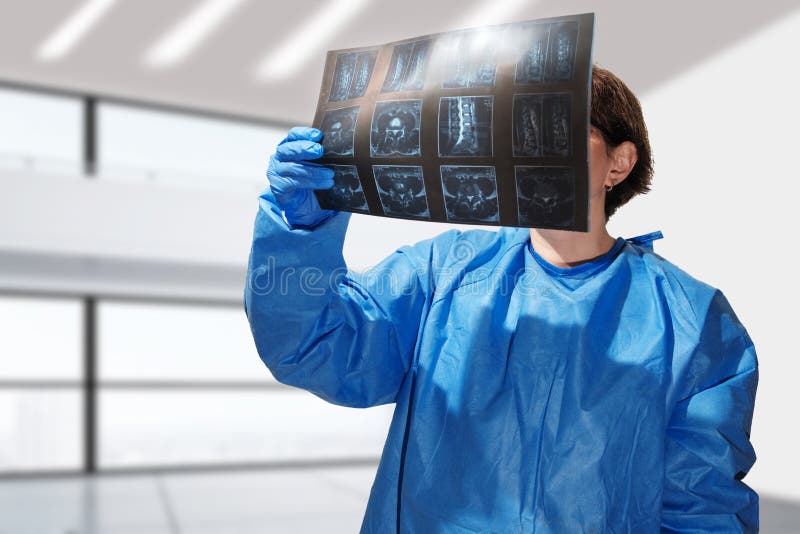 Female Doctor Holding and Analyzes Spine Radiography Stock Image ...