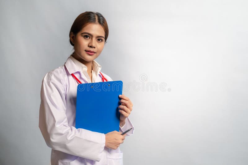 Female Doctor Holding a Blue Notepad Stock Image - Image of pharmacy ...