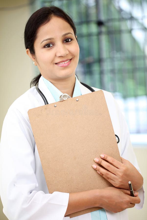 Female Doctor Holding a Clipboard Stock Photo - Image of hospital ...