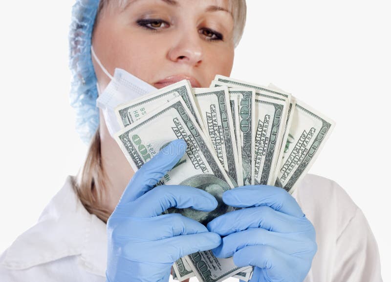 Female Doctor Holding Money Stock Photo - Image of health, salary: 21611392