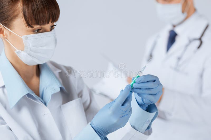 Female Doctor Holding Syringe with Injection Stock Image - Image of ...