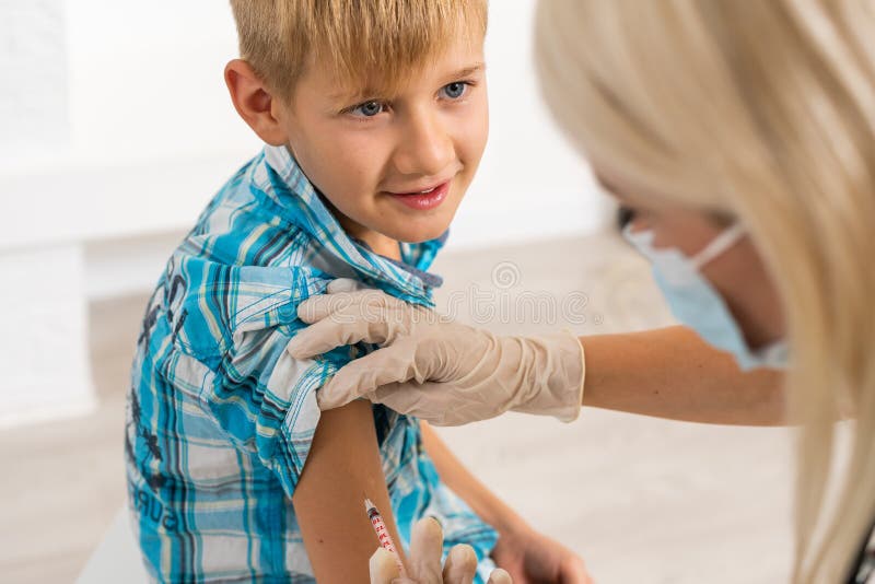 Female Doctor Making Injection To Little Boy Stock Photo - Image of ...