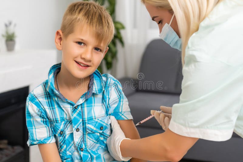 Female Doctor Making Injection To Little Boy Stock Image - Image of ...