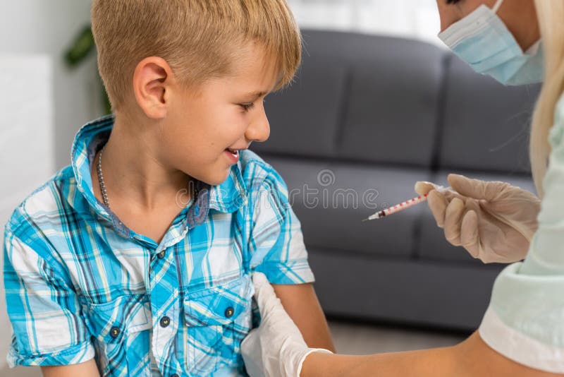 Female Doctor Making Injection To Little Boy Stock Photo - Image of ...