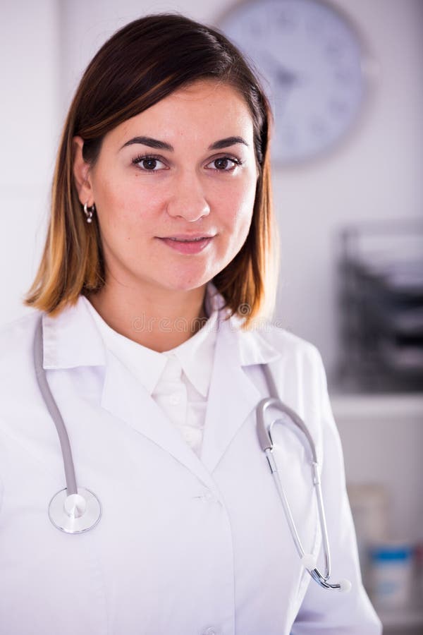 Female Doctor Offering Help Stock Photo - Image of desk, person: 205220882
