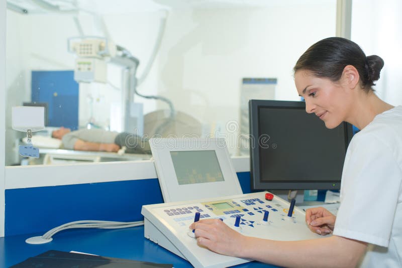 Female Doctor Operating Medical Machine Stock Photo - Image of ...