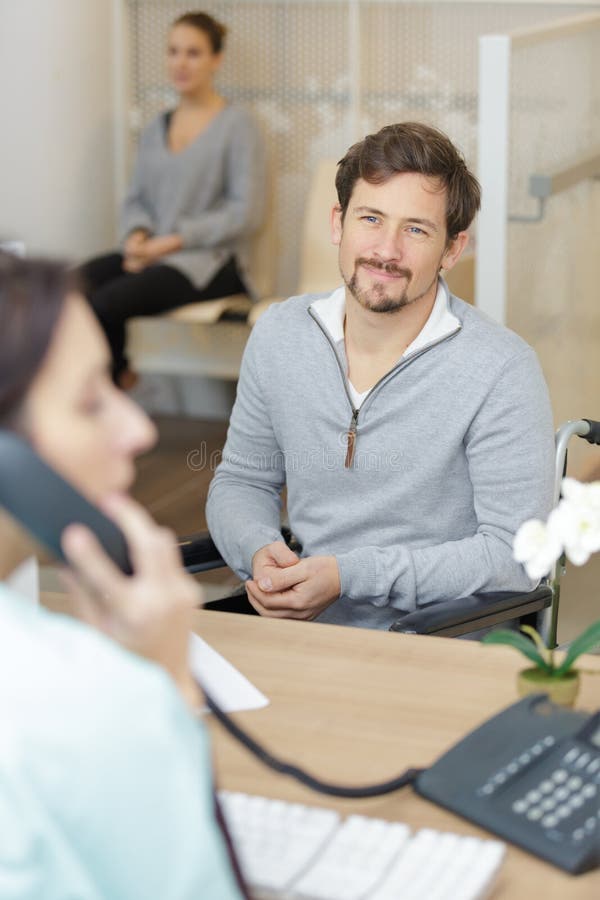 Female Doctor and Patient Standing on Reception Desk Stock Photo ...