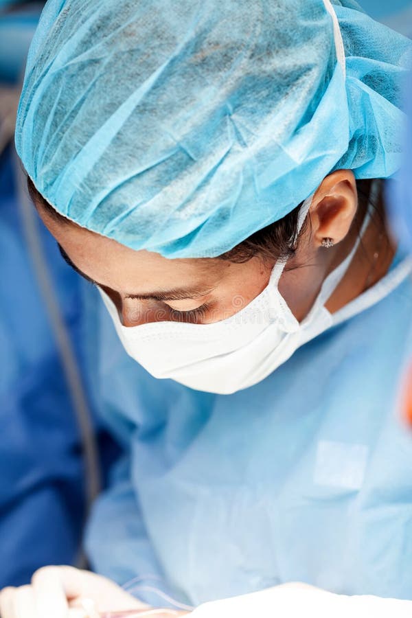 Female Doctor Performing a Surgery. Surgery and Insurance Concept Stock ...