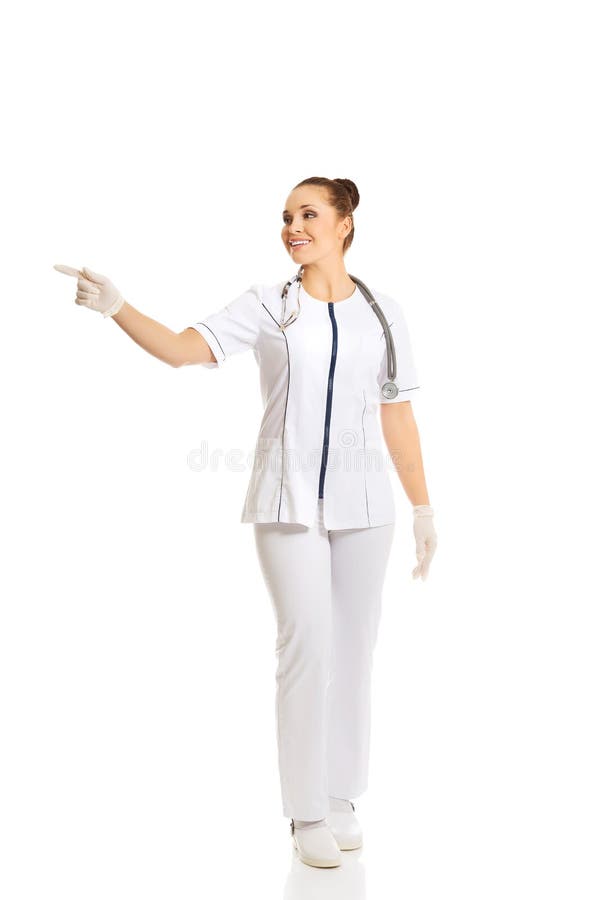 Female Doctor Pointing To the Left Stock Photo - Image of copy ...