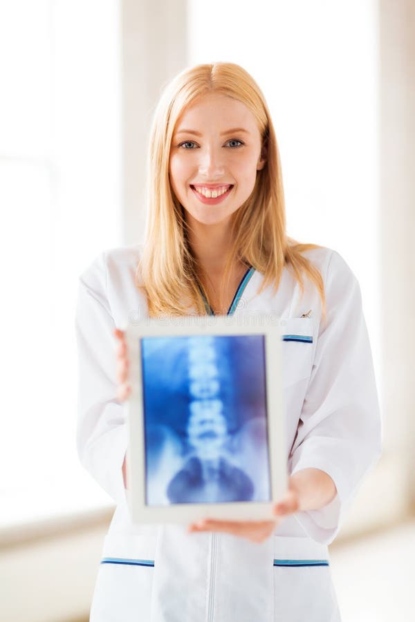 Female Doctor with X-ray on Tablet Pc Stock Photo - Image of education ...
