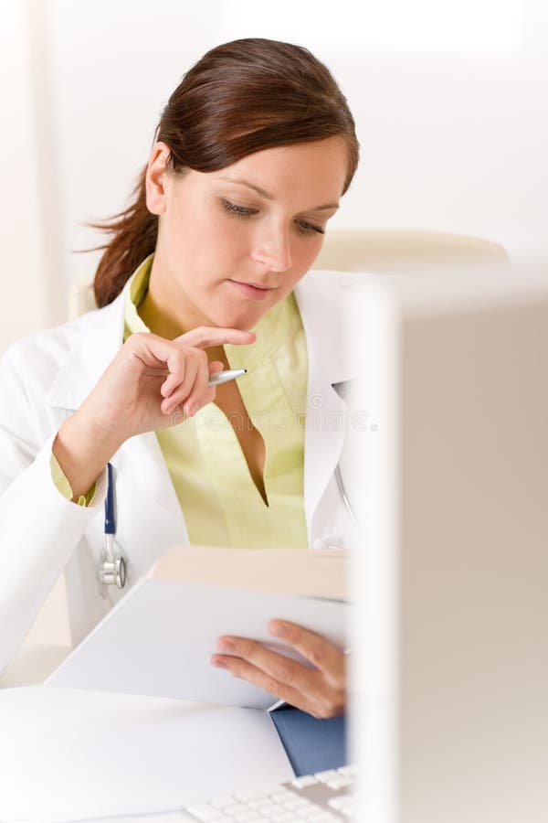 Female Doctor Read Book in Clinic Stock Photo - Image of expertise ...