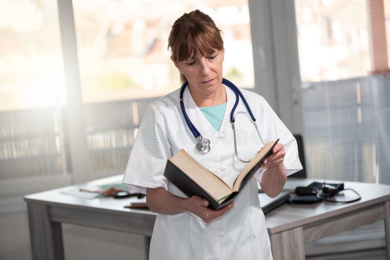 Doctor Reading a Textbook; Panoramic Banner Stock Image - Image of male ...