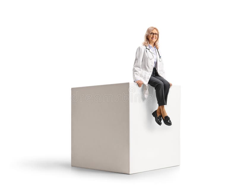Female Doctor Sitting on a White Cube Stock Photo - Image of person ...