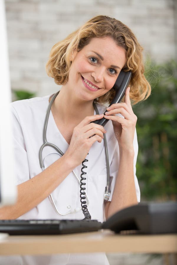 Female Doctor Smile and Using Phone Stock Photo - Image of screen ...