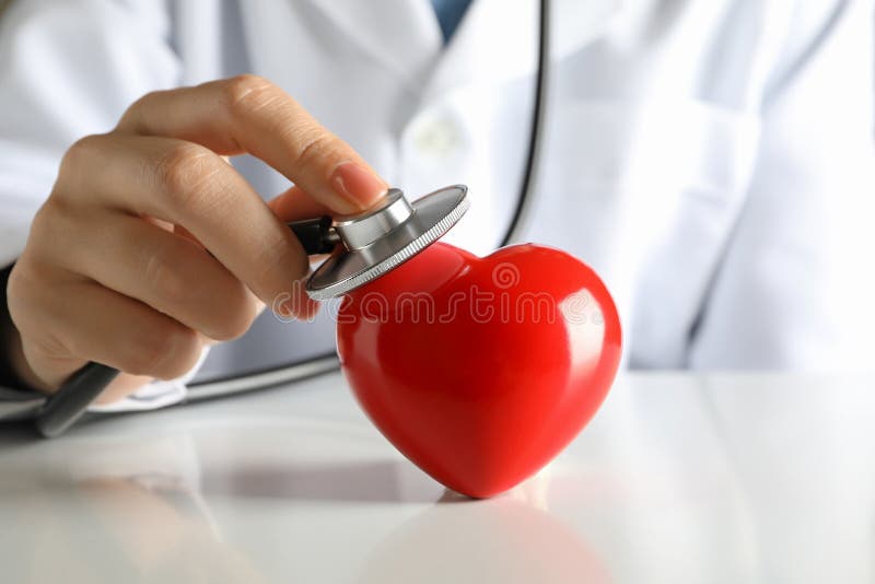 Female Doctor with Stethoscope Checking Heart Beat Stock Photo - Image ...