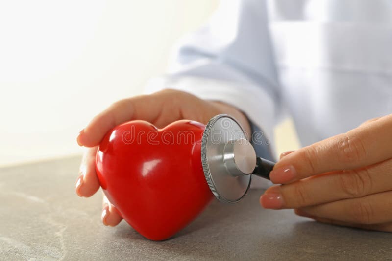 Female Doctor with Stethoscope Checking Heart Beat Stock Image - Image ...