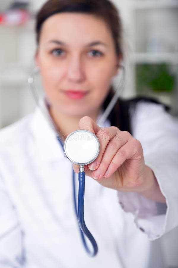 A Female Doctor with a Stethoscope Listening. Stock Image - Image of ...