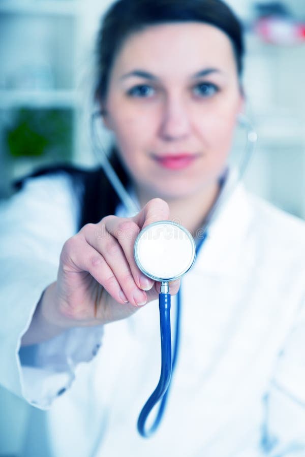 A Female Doctor with a Stethoscope Listening. Stock Image - Image of ...