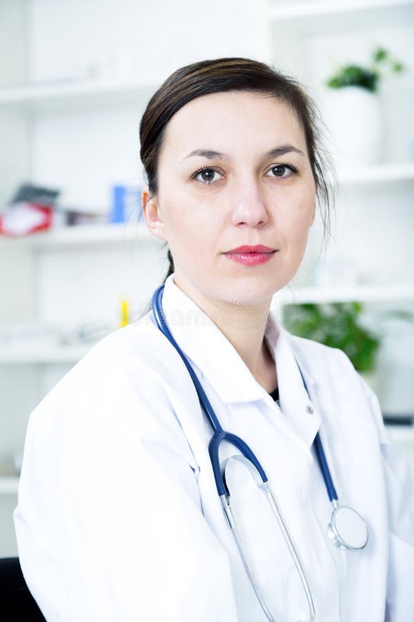 A Female Doctor with a Stethoscope Listening. Stock Image - Image of ...