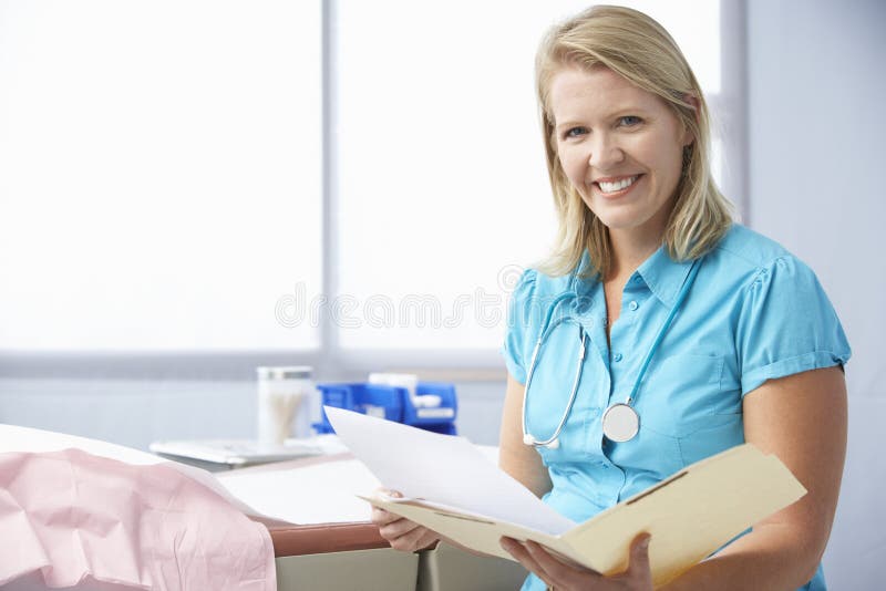 Female Doctor in Surgery Reading Patient Notes Stock Photo - Image of ...