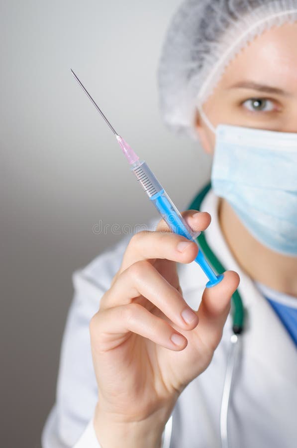 Female doctor with syringe stock photo. Image of healthcare - 57631348