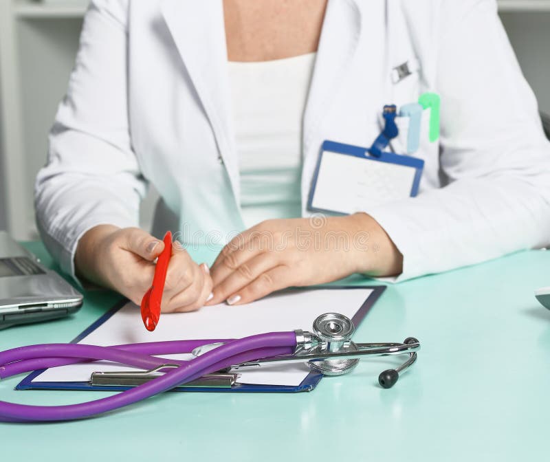 Female Doctor at the Table in the Office Stock Image - Image of busy ...