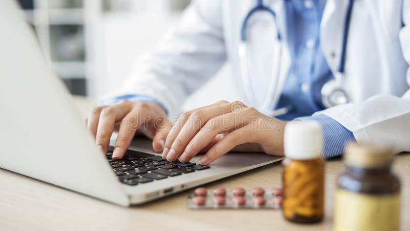 Female Doctor Typing on Computer Stock Photo - Image of data, input ...