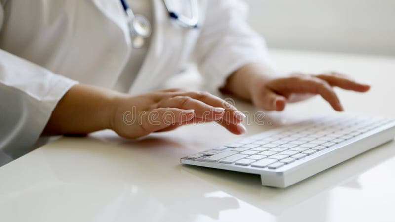 Female Doctor Typing on Keyboard in the Office Stock Footage - Video of ...